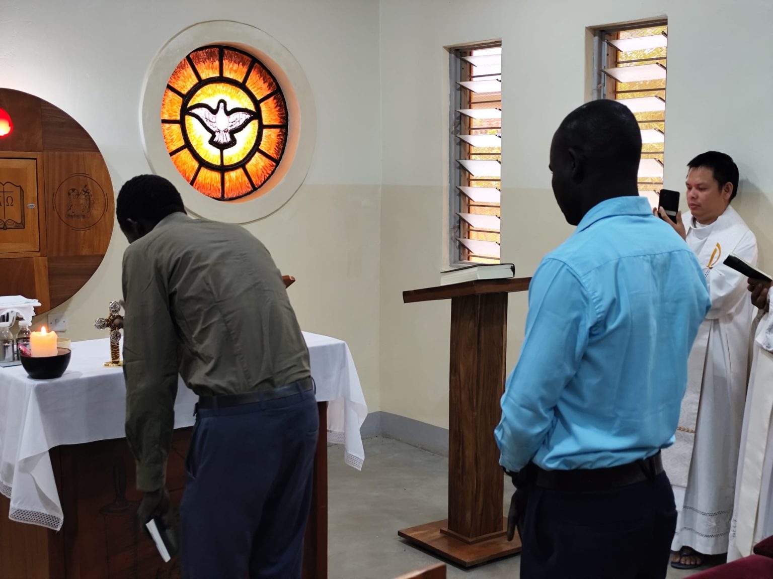 Celebrating the mass and paying for two new candidates in our community ...